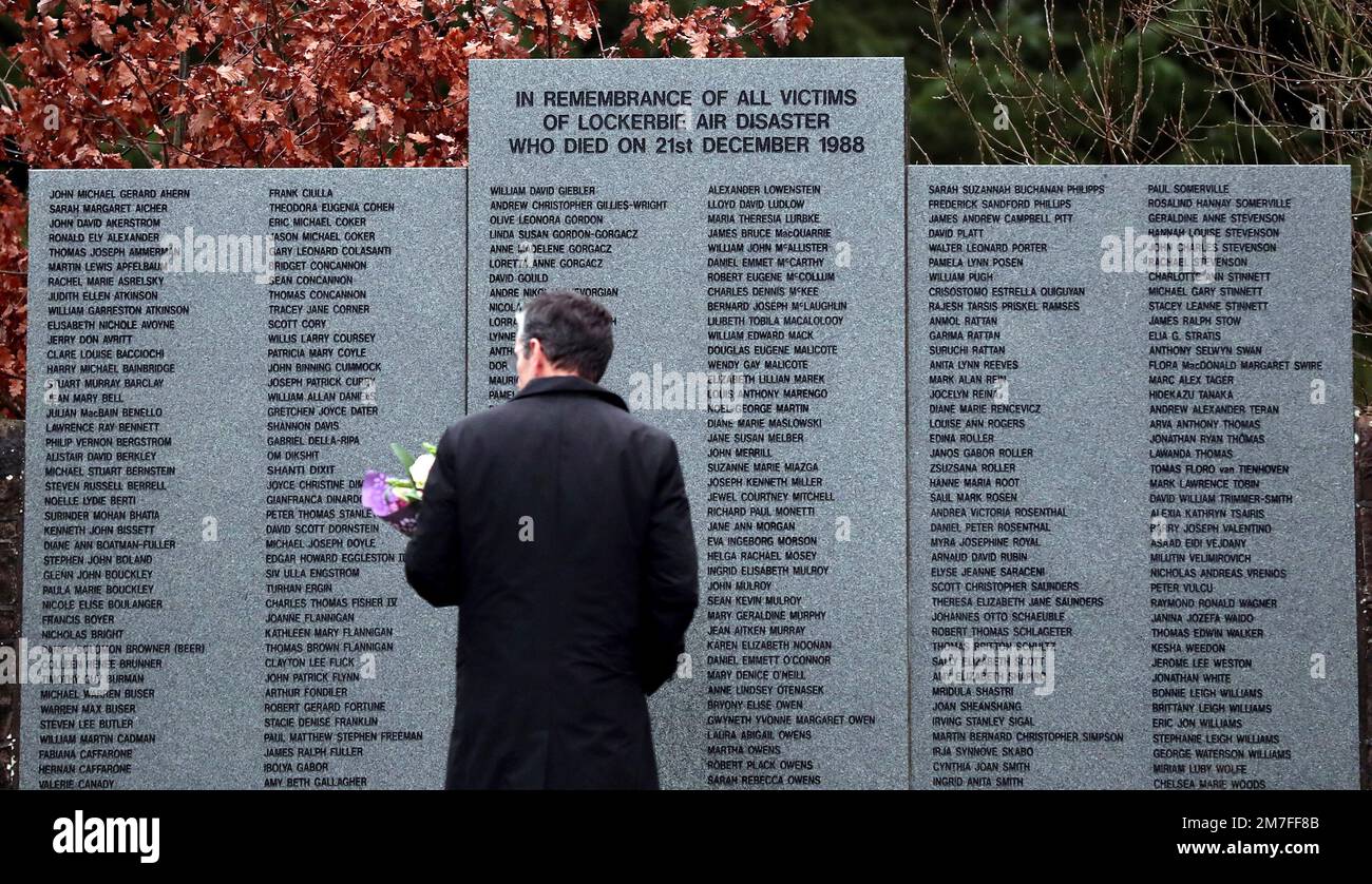 FILE - A man looks at the main memorial stone in memory of the victims ...