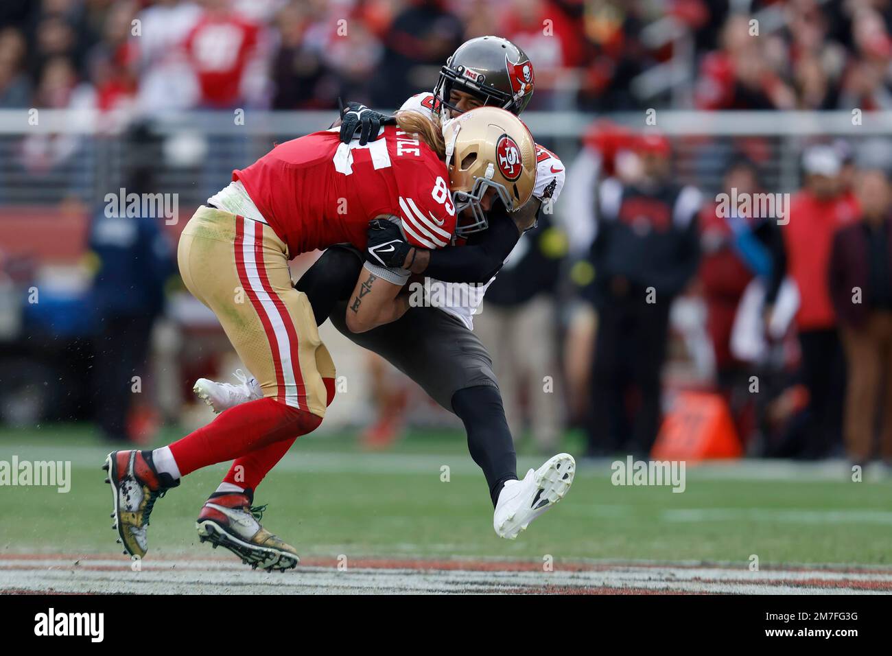 San Francisco 49ers tight end George Kittle, left, runs against Tampa ...