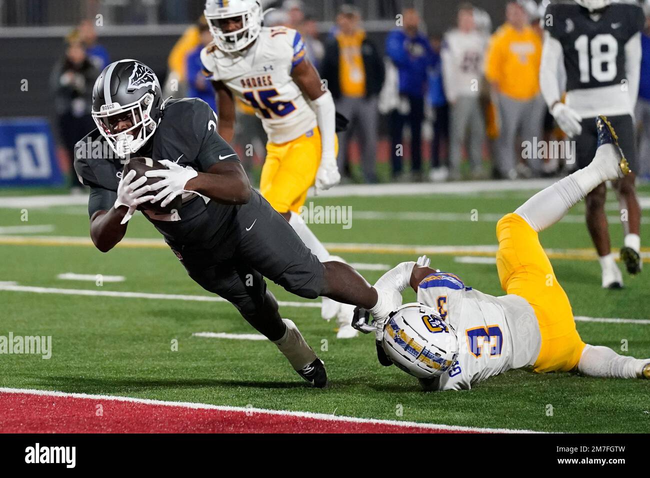 St. John Bosco's Khalil Warren (24) falls over the goal line for a ...
