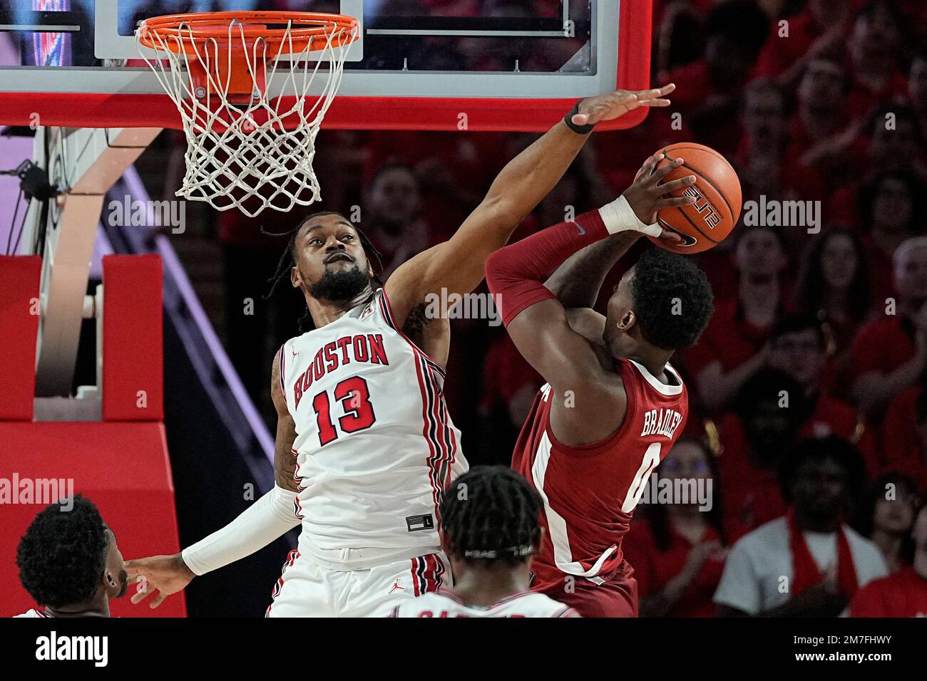 Houston forward J'Wan Roberts (13) fouls Alabama guard Jaden Bradley (0 ...