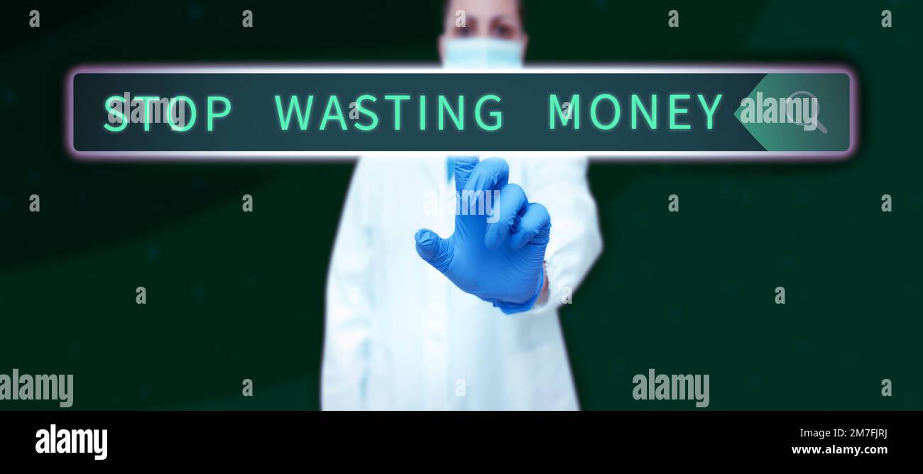 Sign displaying Stop Wasting Money. Internet Concept advicing person or ...