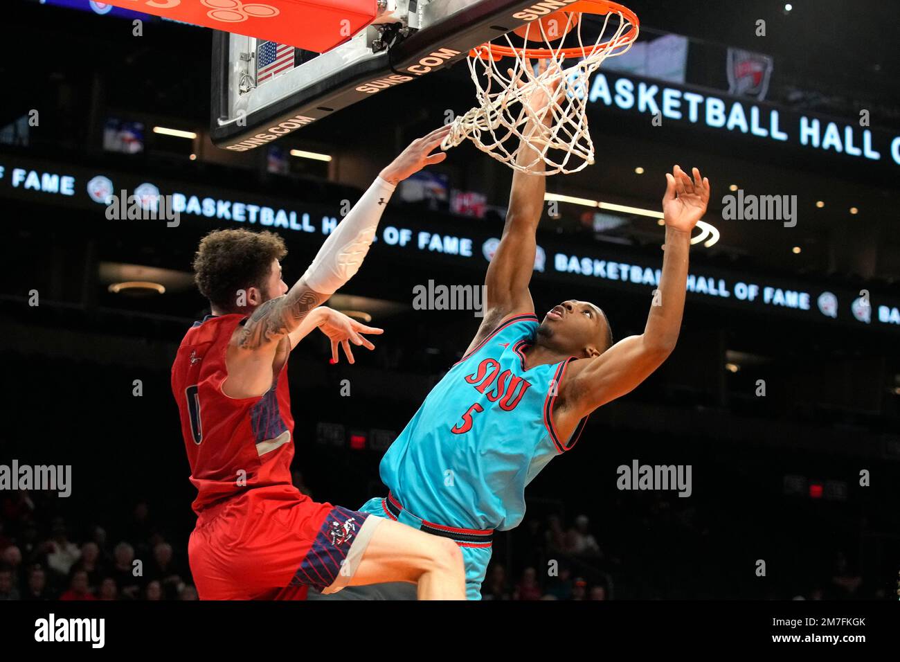 San Diego State guard Lamont Butler (5) shoots over St. Mary's guard ...