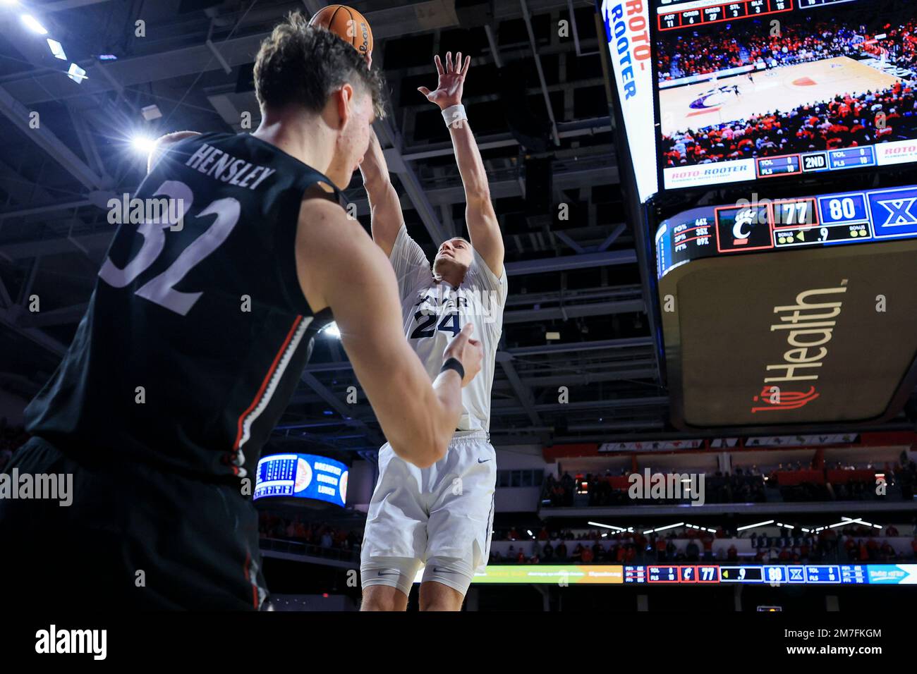 Xavier's forward Jack Nunge (24) deflects the ball as Cincinnati's ...