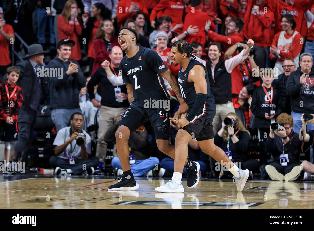 Cincinnati's guard Landers Nolley II, left, yells alongside guard CJ ...