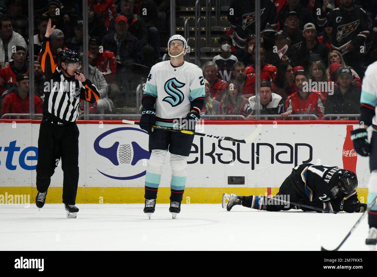 Washington Capitals defenseman Alexander Alexeyev (27) lies on the ice ...
