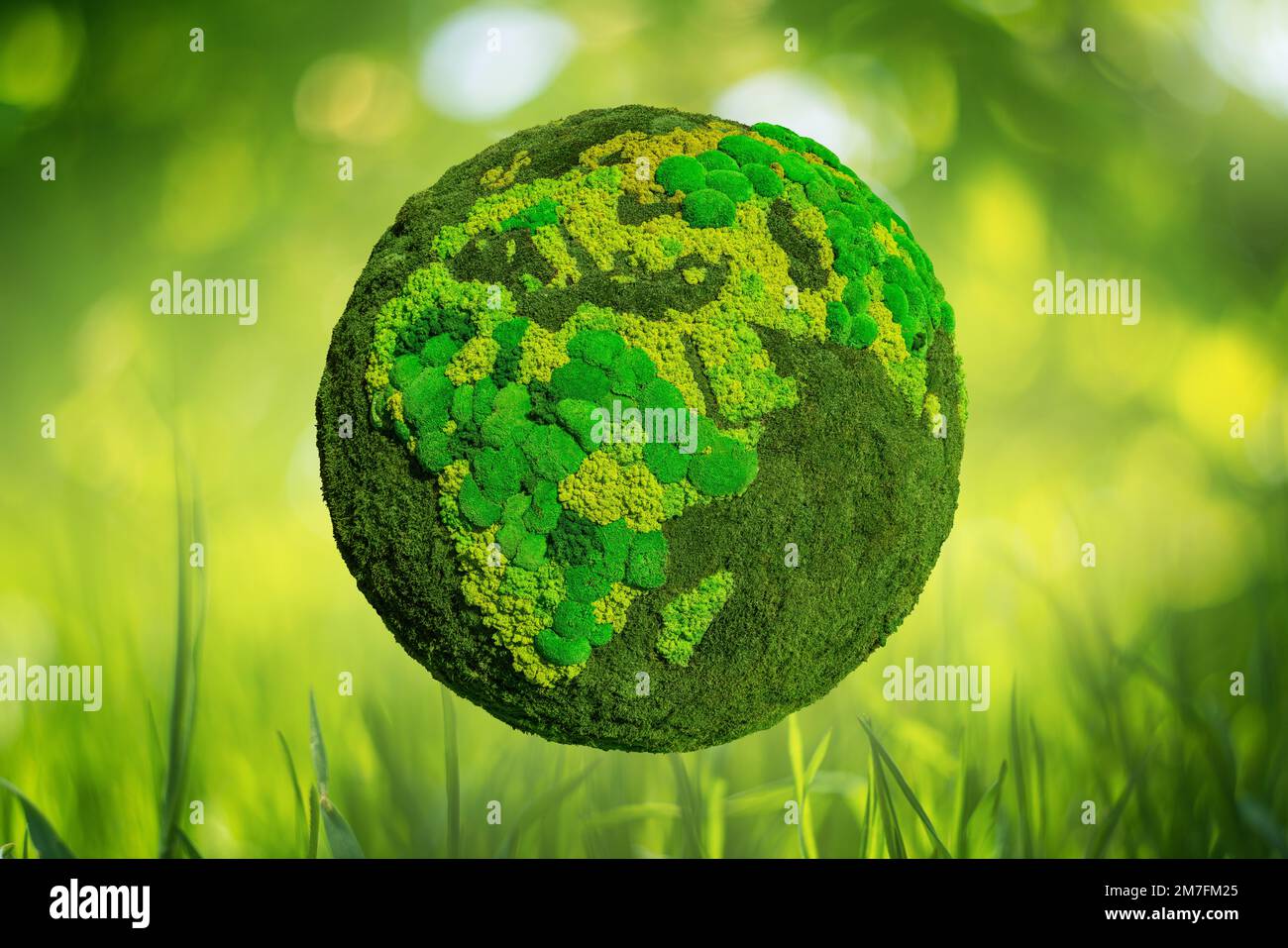 Green planet Earth from natural moss on a blured nature background ...