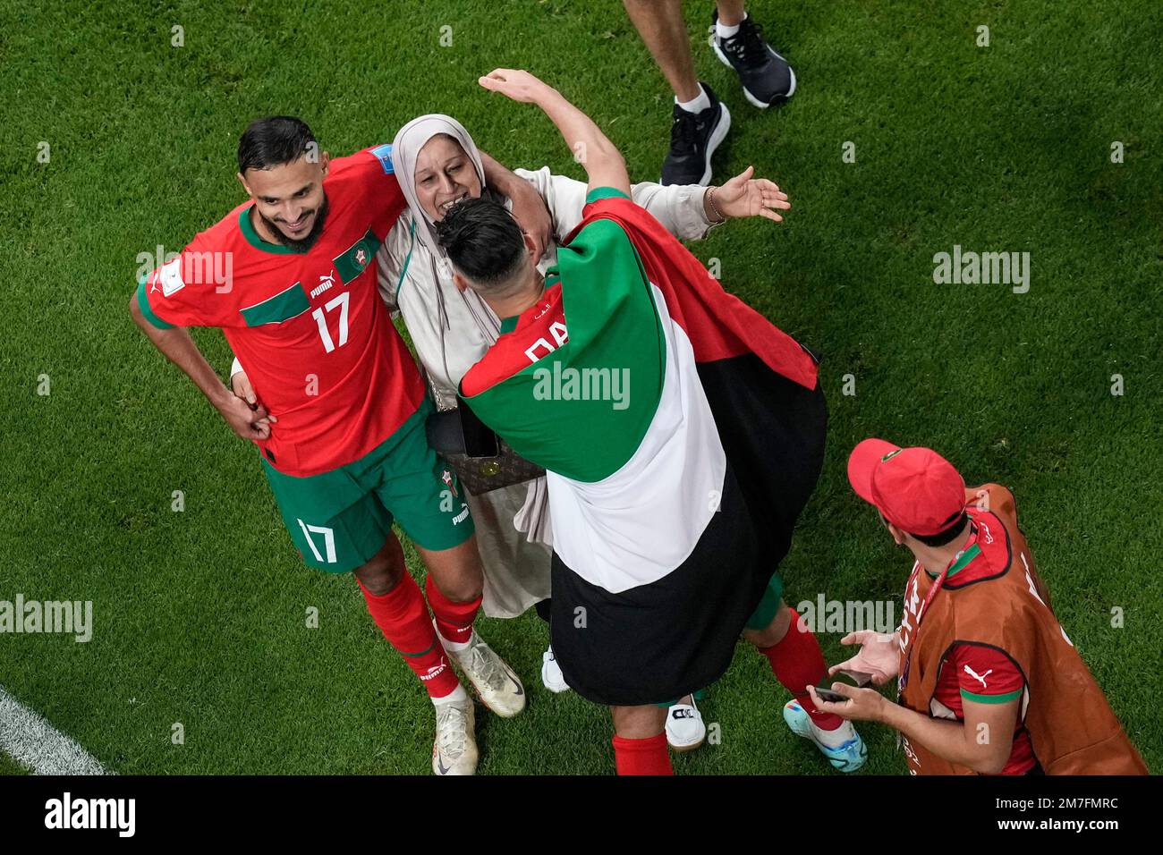 Morocco's Achraf Daria, with a Palestine flag celebrates next to his ...