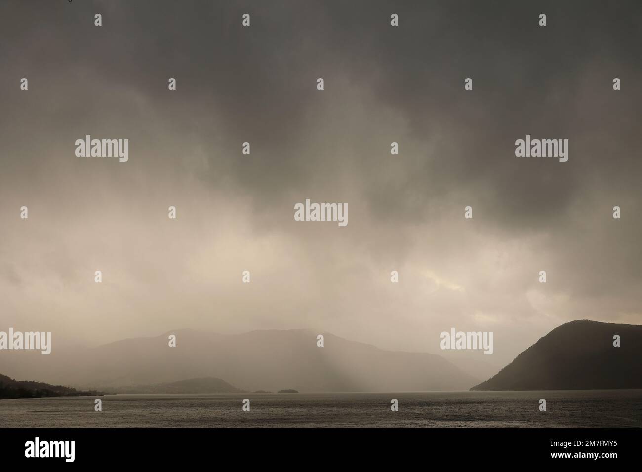 Low rain clouds in a fjord near Rosendal in Norway Stock Photo - Alamy