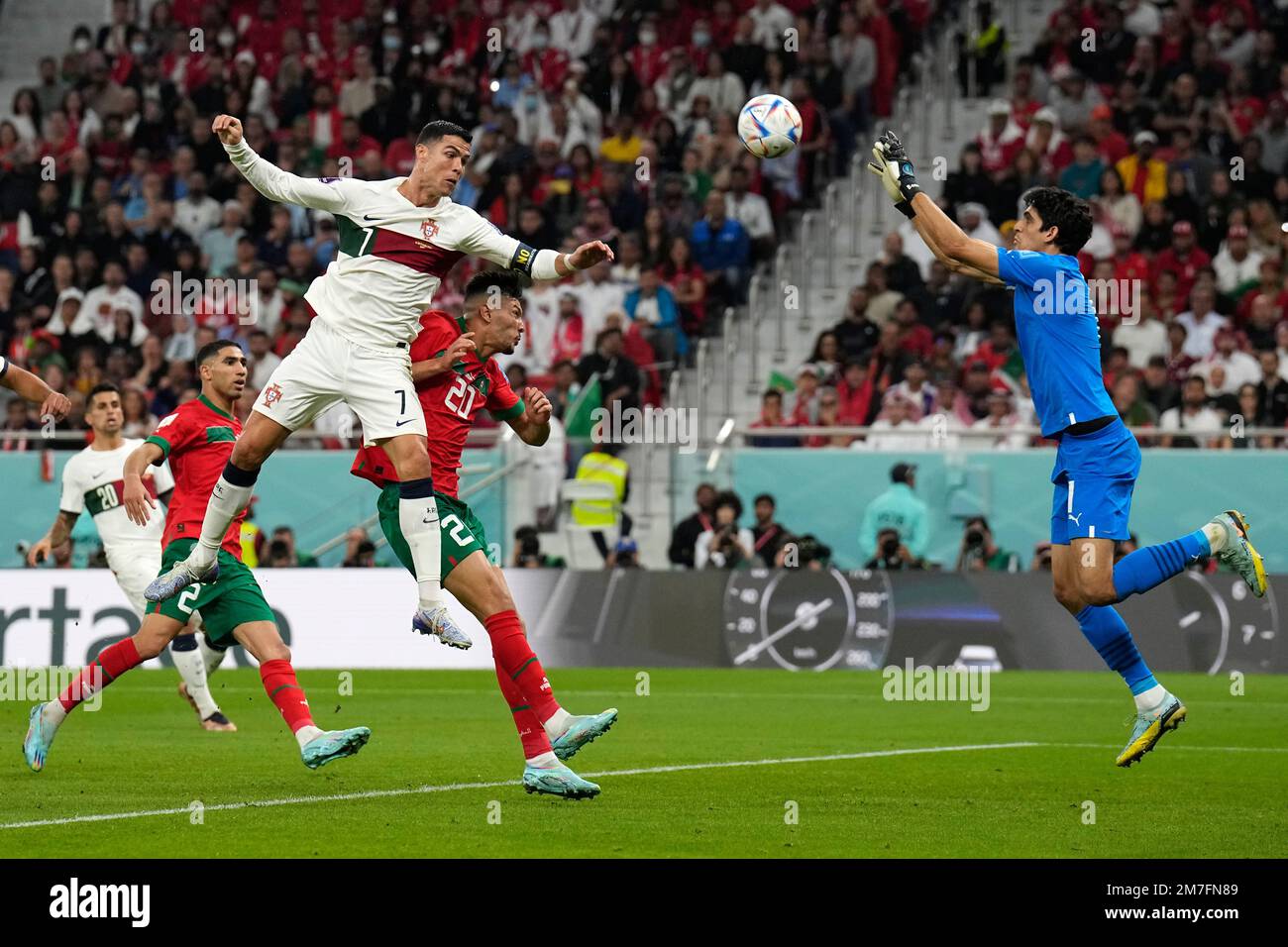 Morocco's goalkeeper Yassine Bounou catches the ball next to Portugal's ...