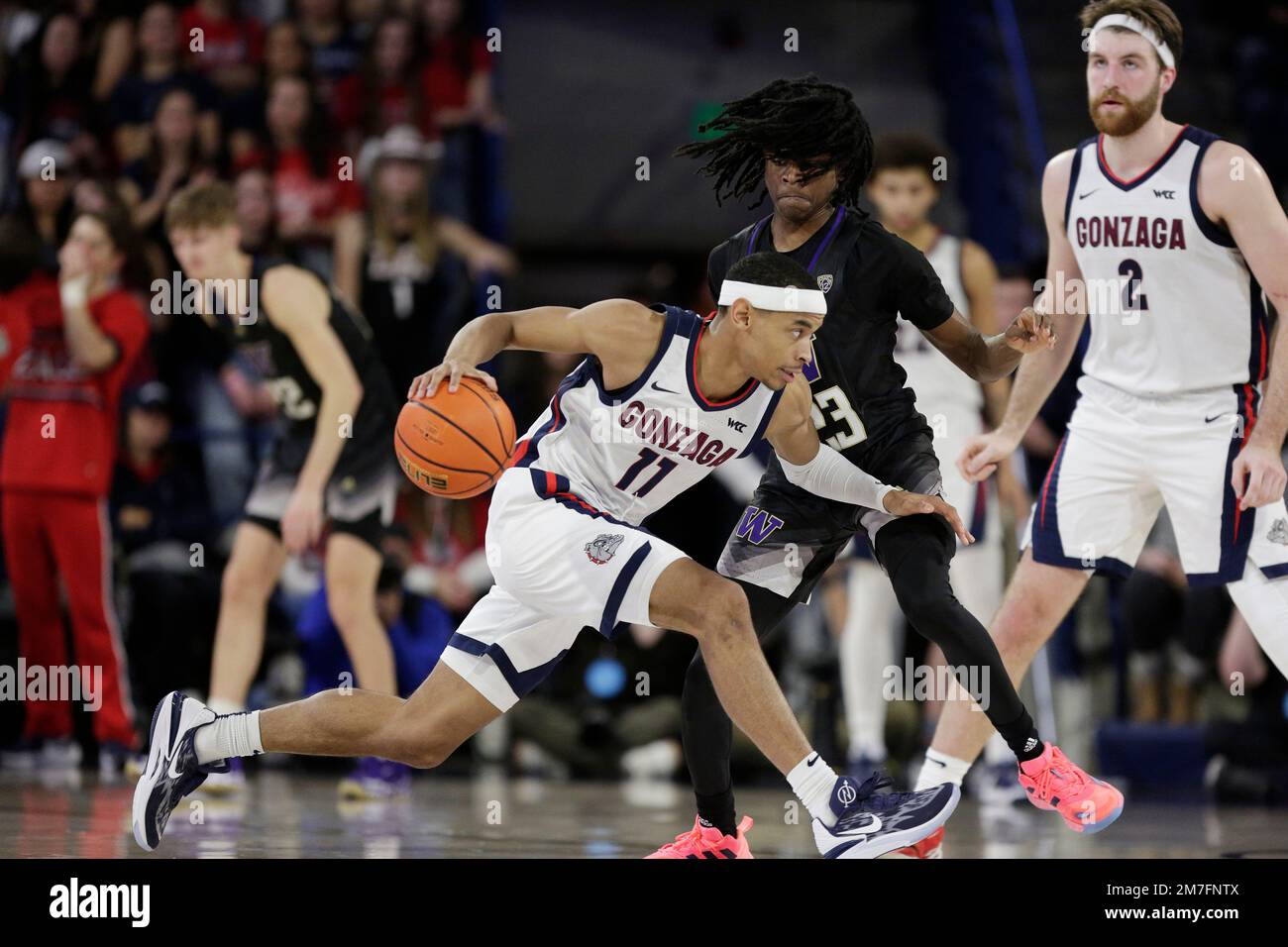 Gonzaga guard Nolan Hickman, left, controls the ball while defended by ...