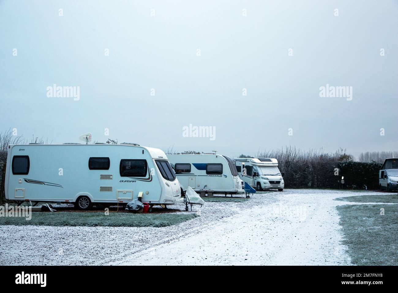 Caravans on Warwick caravan club camp site during a winter snowfall ...