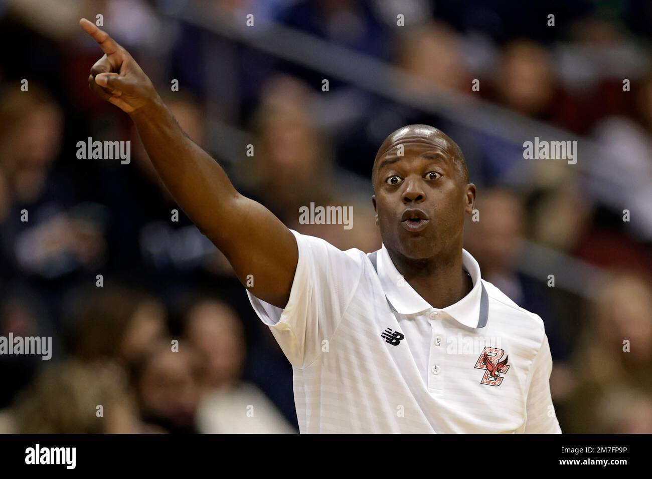 Boston College coach Earl Grant gestures to the team during the first ...