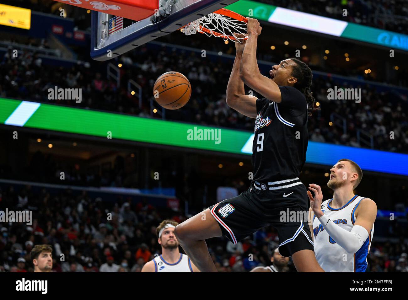 Los Angeles Clippers center Moses Brown (9) dunks against Washington ...