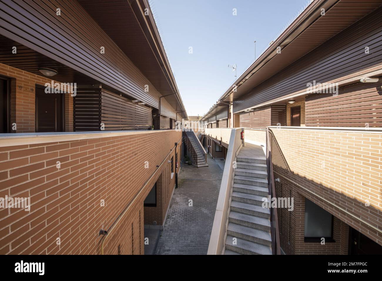 Interior stone stairs of two-story residential buildings with brick and ...