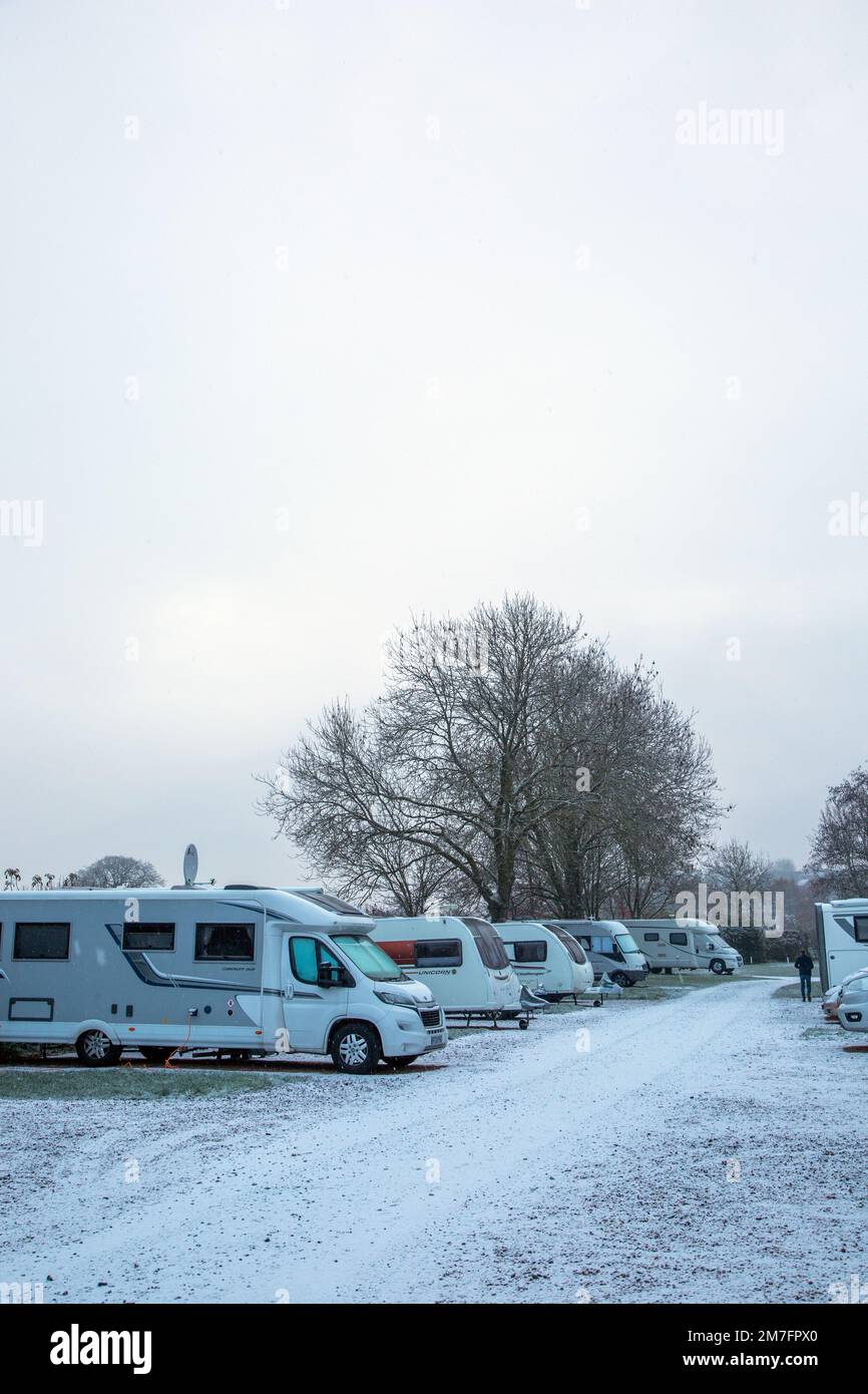 Caravans on Warwick caravan club camp site during a winter snowfall ...