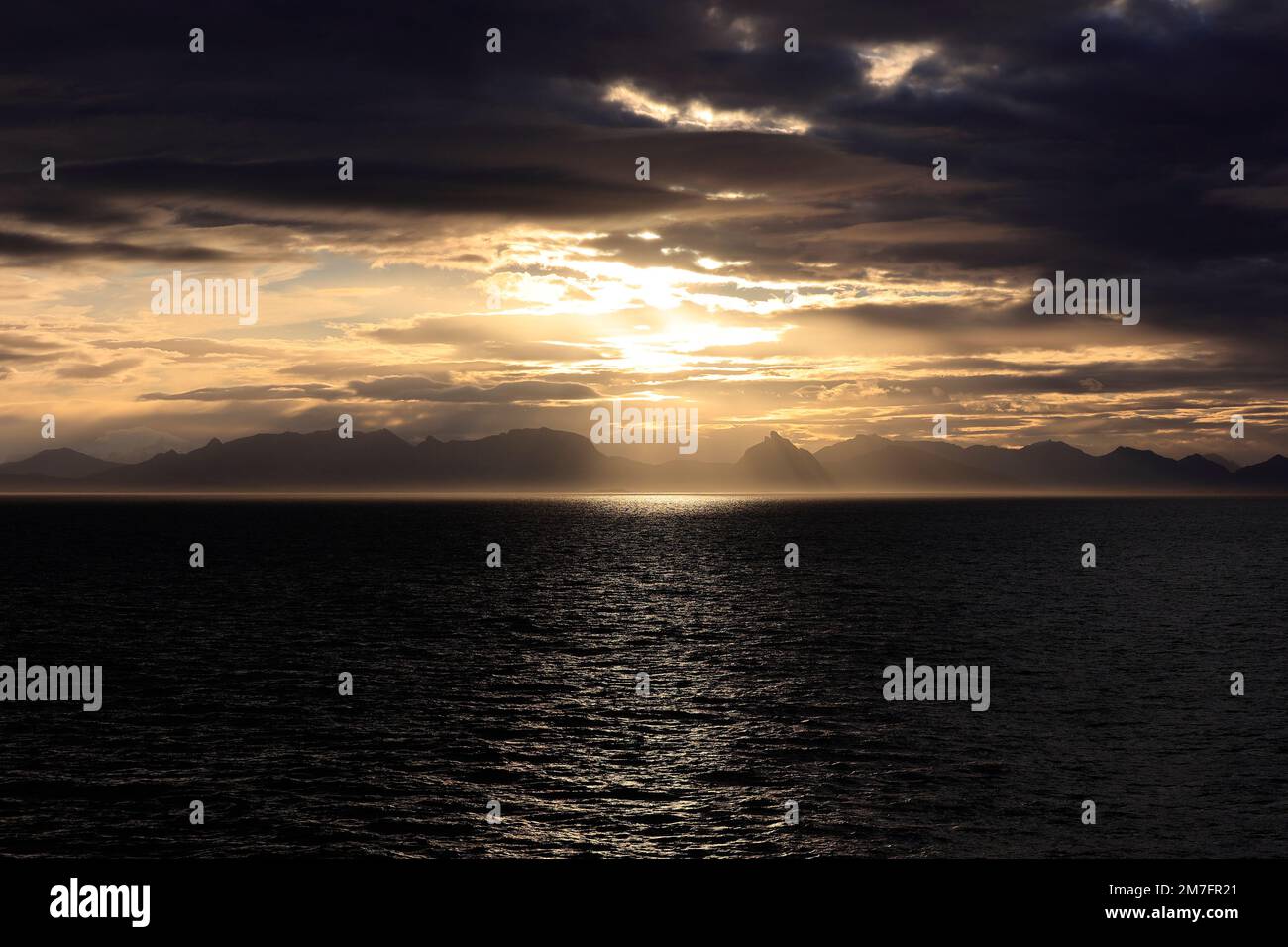 Sunset at the coast of Svolvaer in Norway Stock Photo - Alamy