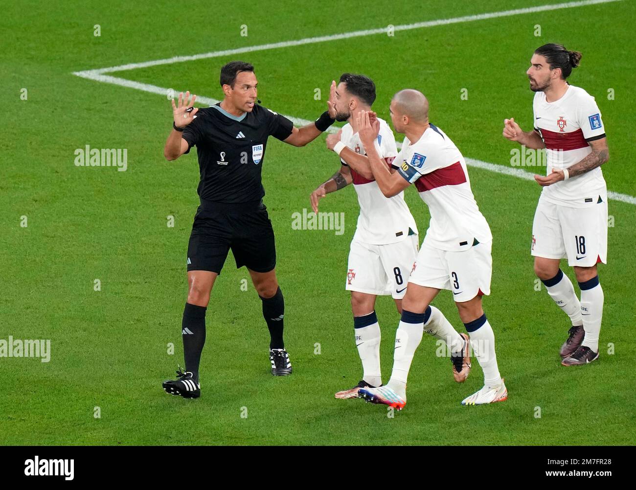 Referee Facundo Tello, left discusses with Portugal players during the ...
