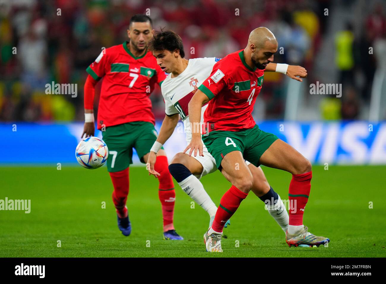 Portugal's Joao Felix, center, is challenged by Morocco's Sofyan ...