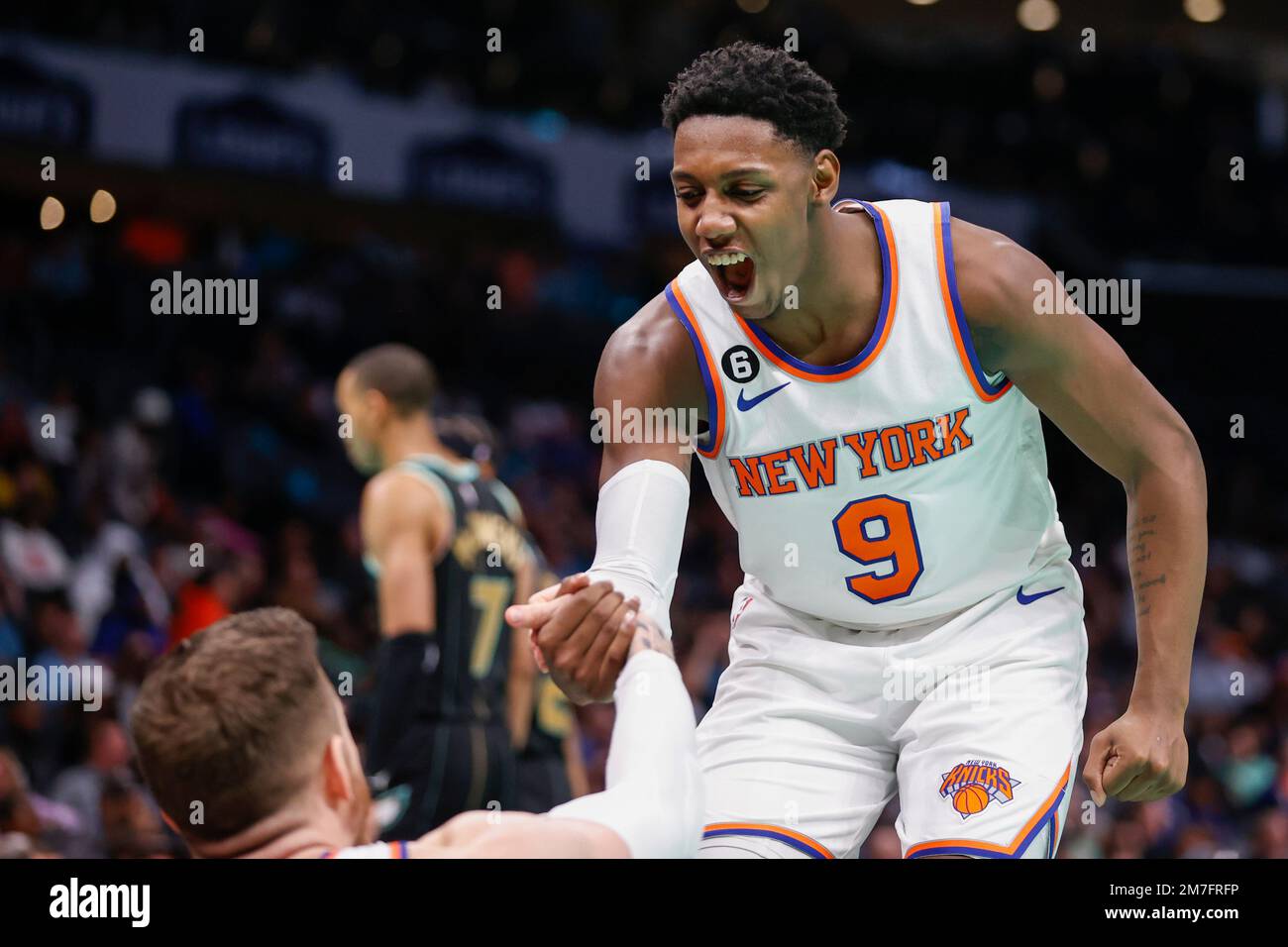 New York Knicks guard RJ Barrett (9) helps teammate Isaiah Hartenstein ...