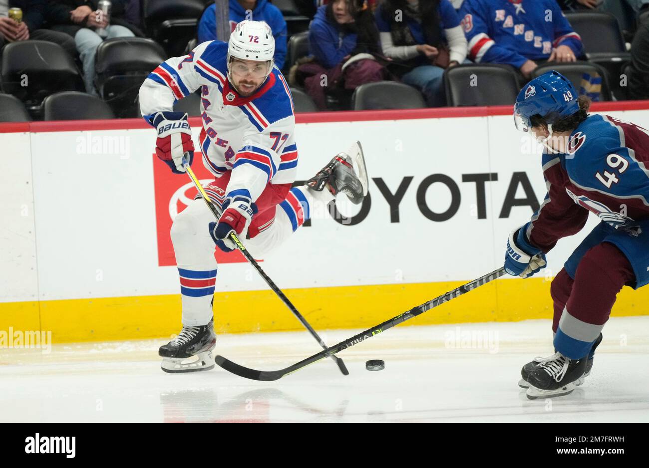 New York Rangers center Filip Chytil, left, shoots the puck past the ...