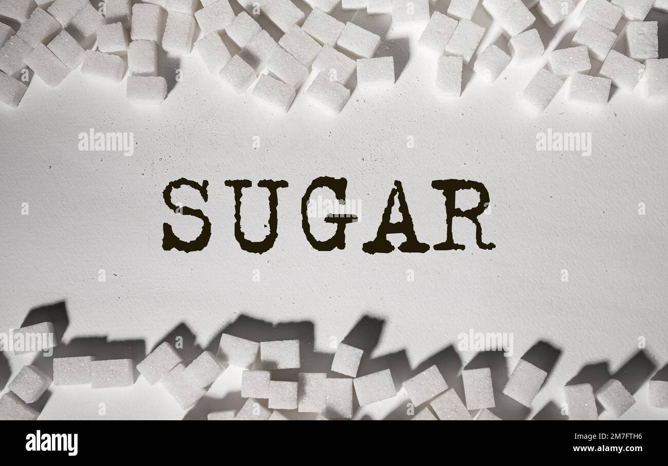 Sugar word, text on white background with beet refined sweetener, sweet ...