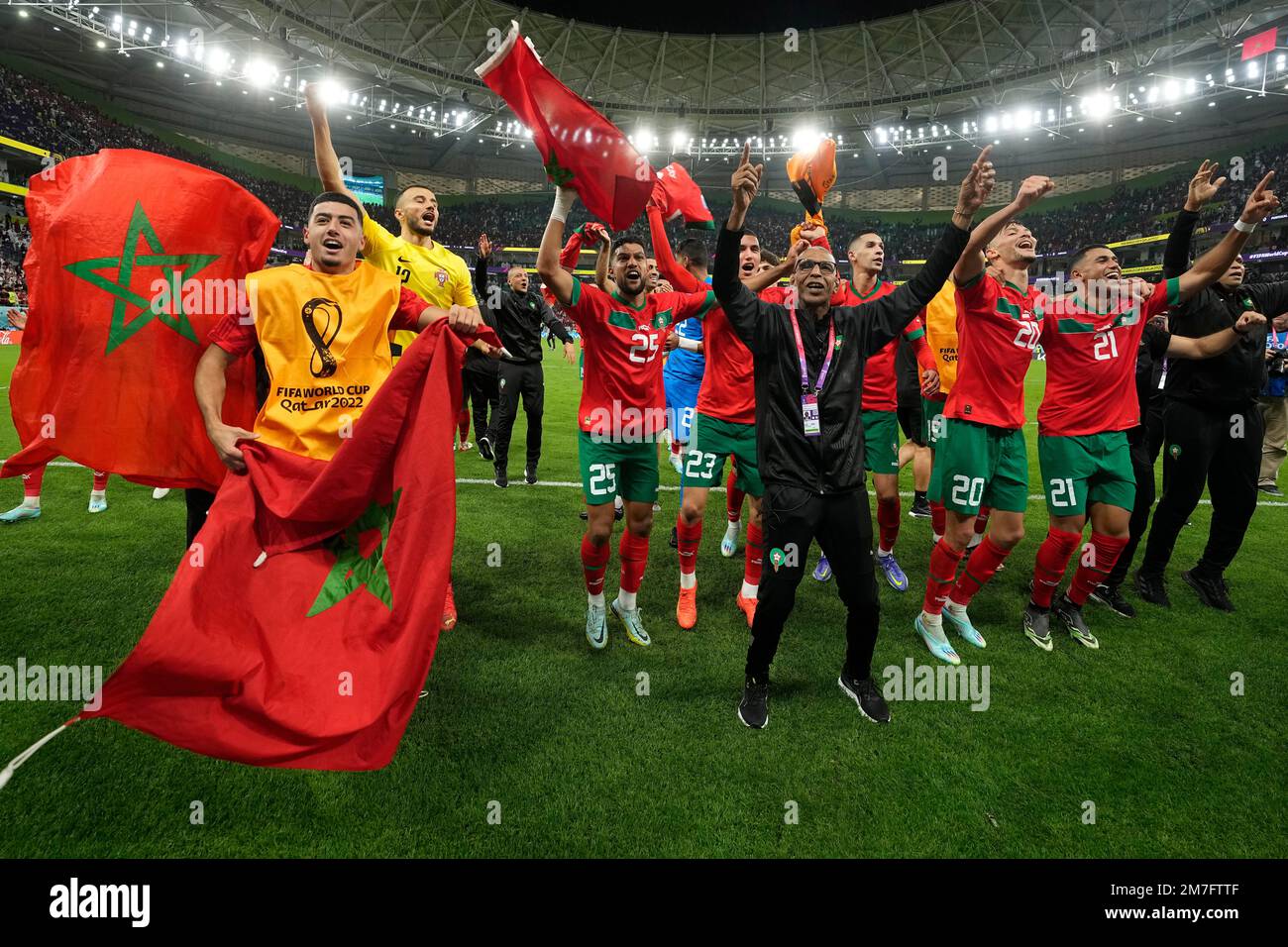 Morocco's players celebrate after the World Cup quarterfinal soccer ...