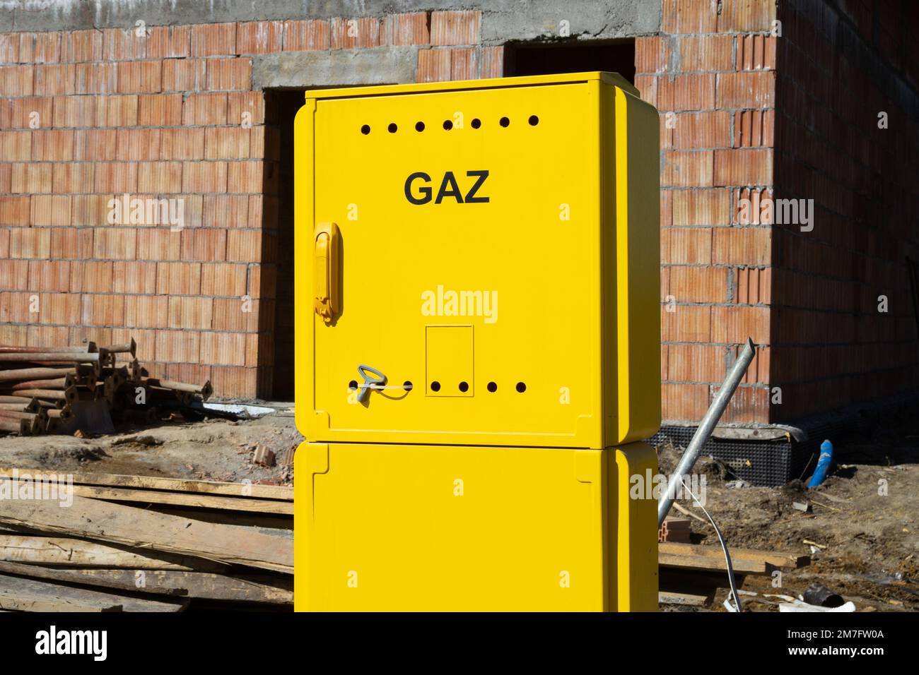 Yellow metal gas connection box at the construction site of new house ...