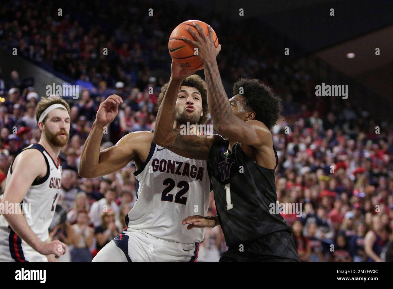 Washington forward Keion Brooks (1) drives to the basket while defended ...