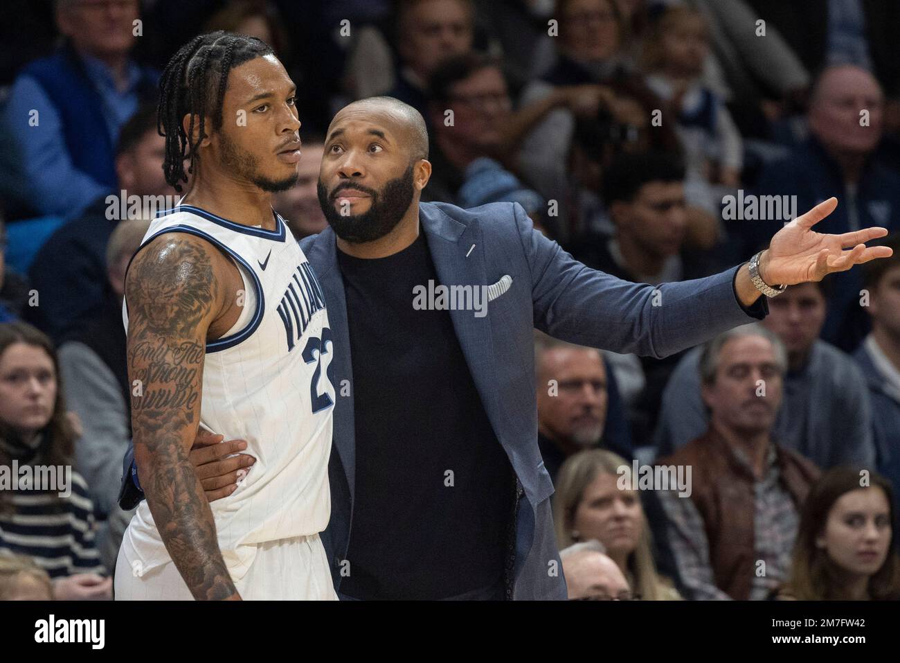 Villanova head coach Kyle Neptune talks to forward Cam Whitmore (22 ...