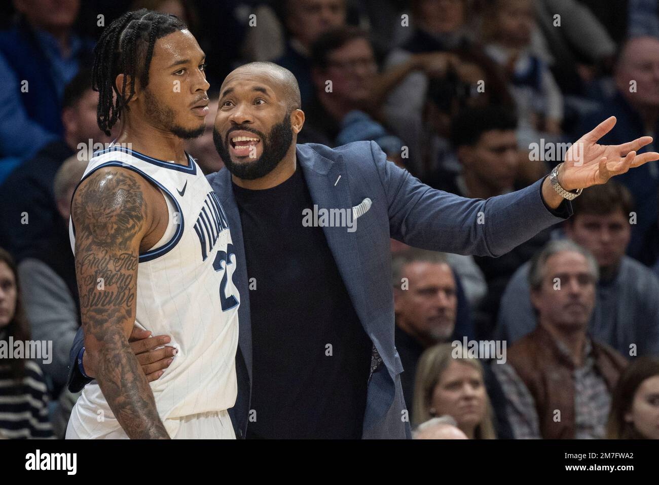 Villanova head coach Kyle Neptune talks to forward Cam Whitmore (22 ...