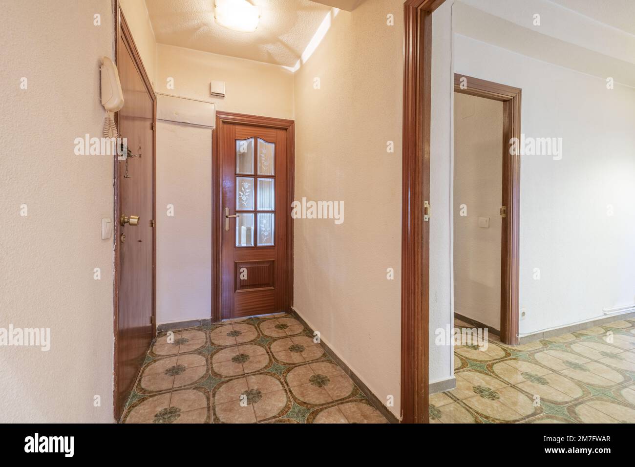 Entrance hall of an urban residential house with armored doors with ...