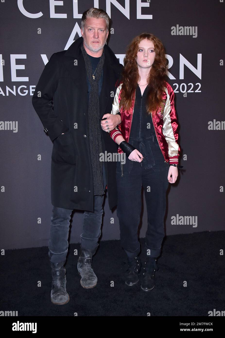 Josh Homme, left, and Camille Harley Joan Homme arrive at the Celine ...