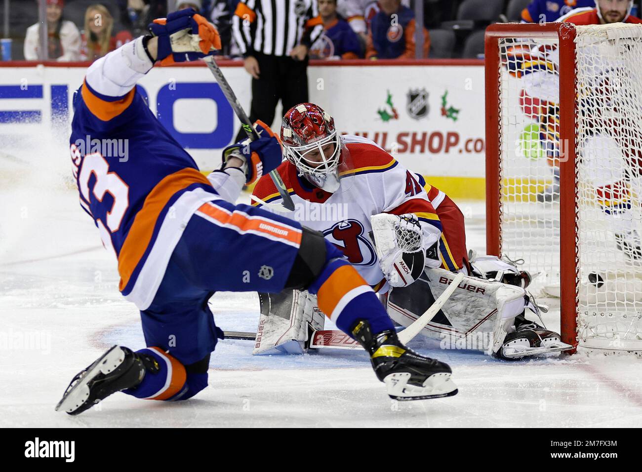 New York Islanders center Casey Cizikas scores a goal past New Jersey ...