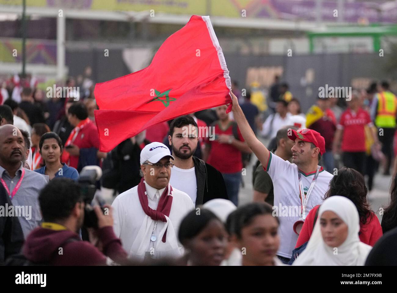 A Moroccan supporter waves his national flag as he arrives ahead of the ...