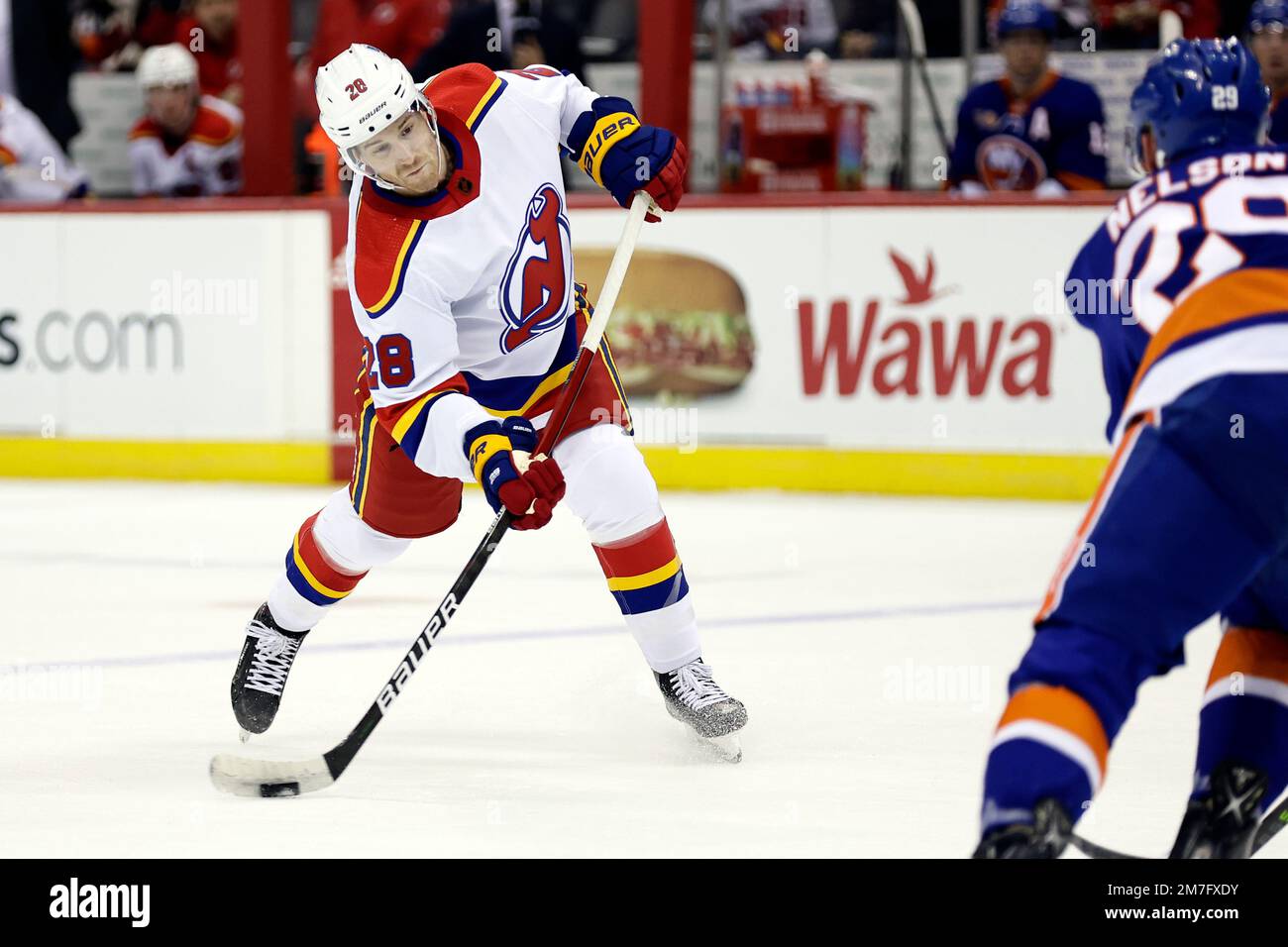 New Jersey Devils defenseman Damon Severson (28) shoots against the New ...