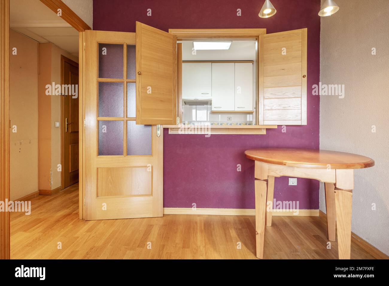 Living room with a round pine wood dining table in the corner and a ...