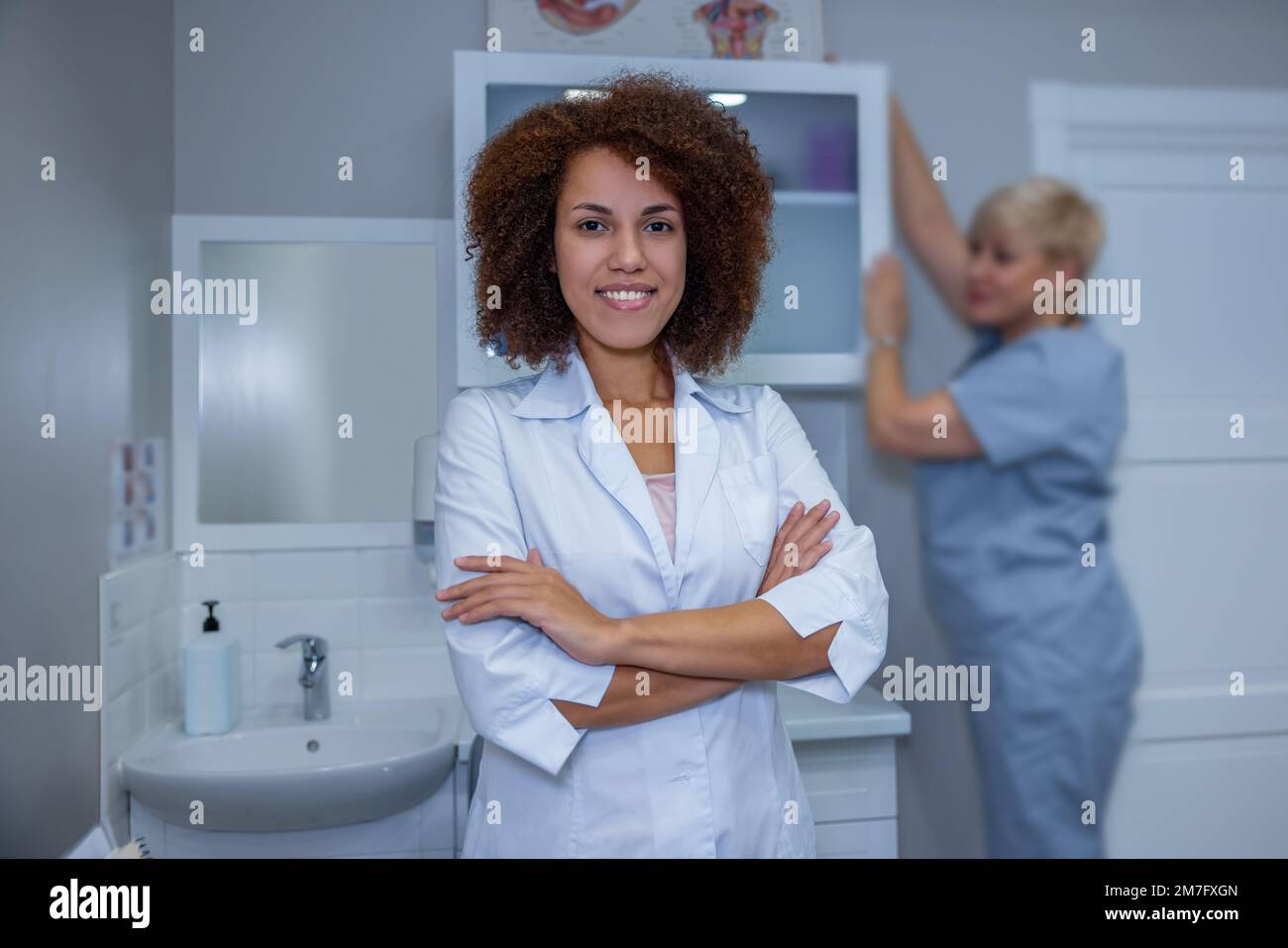 Two female doctors at work looking positive Stock Photo - Alamy