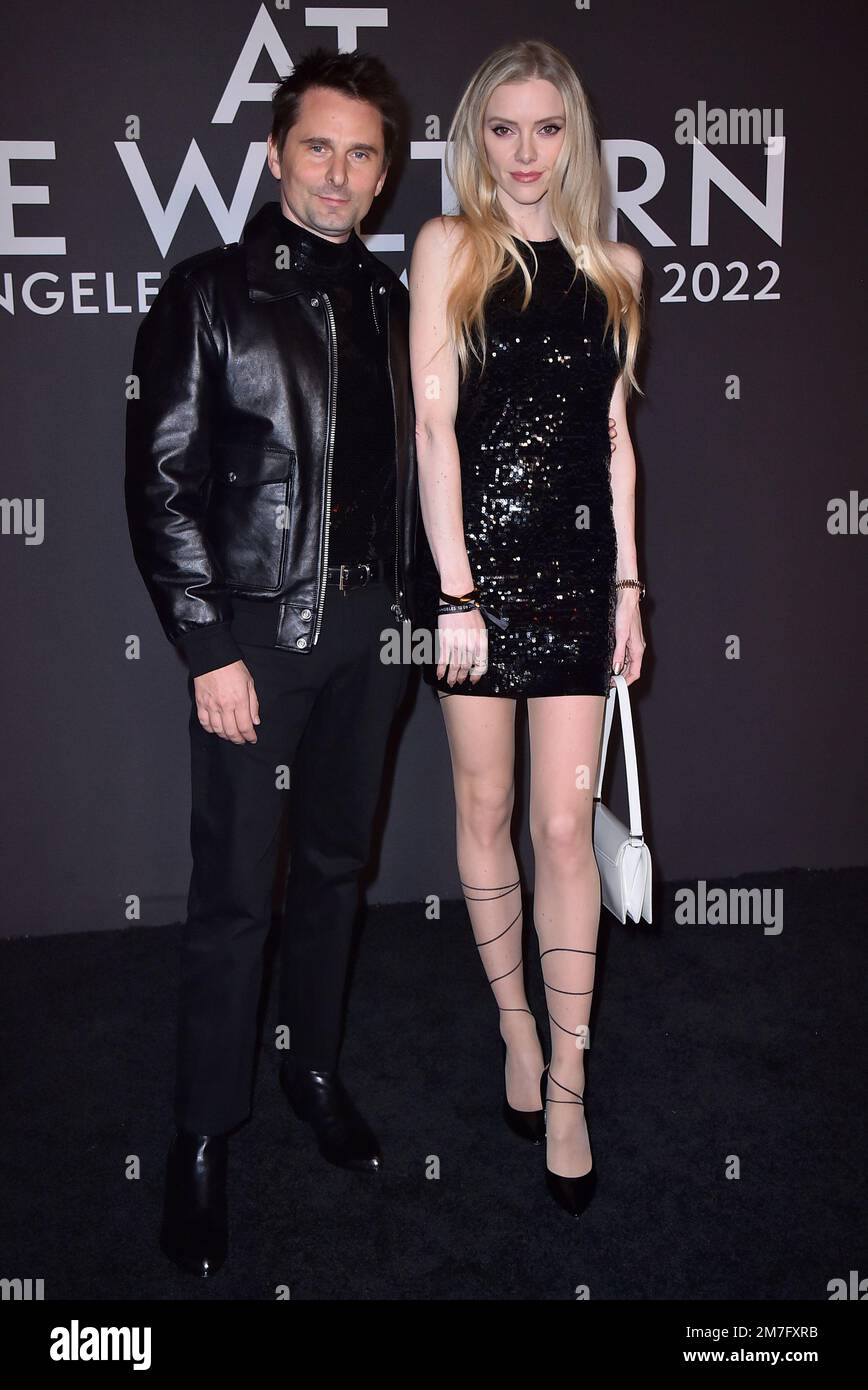 Matt Bellamy, left, and Elle Evans arrive at the Celine Fall/Winter ...