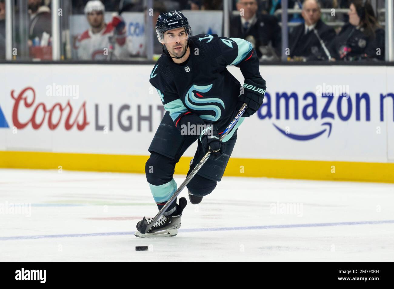 Seattle Kraken defenseman Justin Schultz skates with the puck during an ...