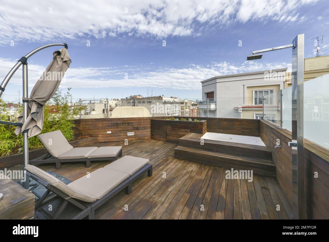 Terrace in penthouse house all covered in acacia wood planks with a ...