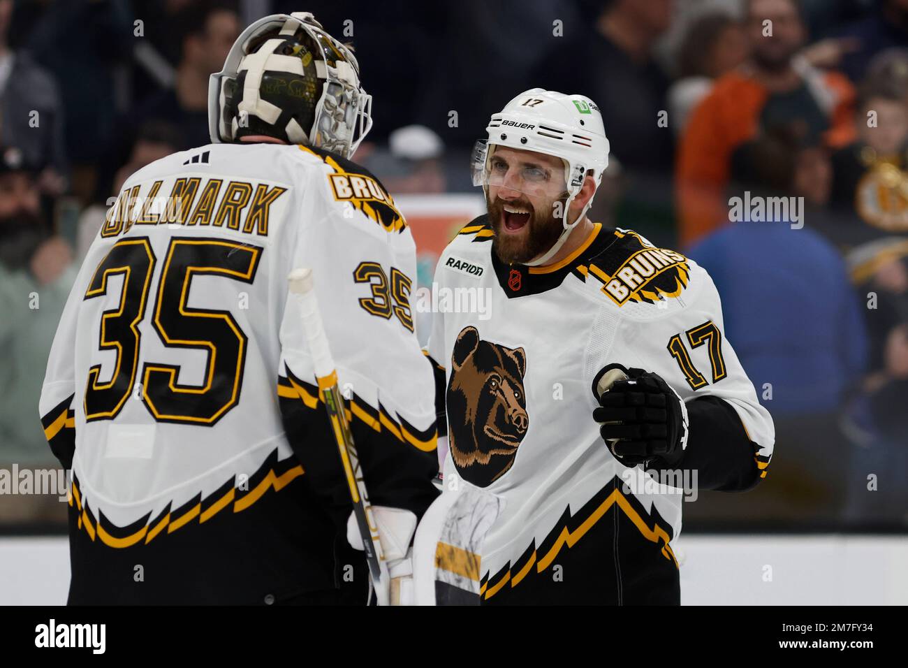 Boston Bruins goaltender Linus Ullmark is congratulated by Nick Foligno ...