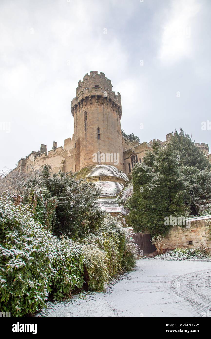 Warwick castle after a light winter snowfall seen from Mill Street ...
