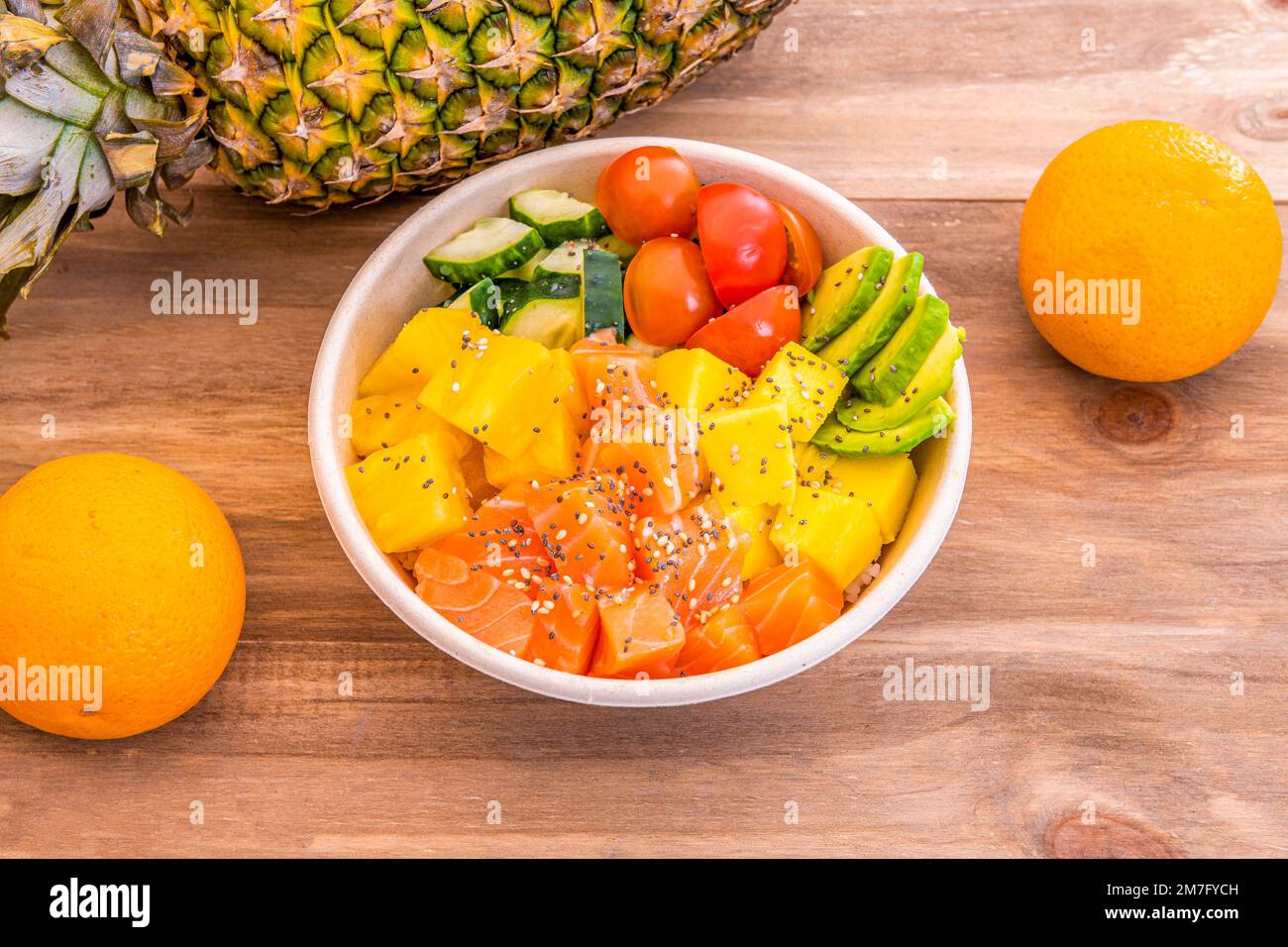A wonderful salmon poke bowl with mango, Mexican avocado, cherry ...
