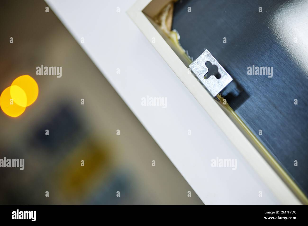 An abstract image of the back of a mirror with wall hanging piece Stock ...