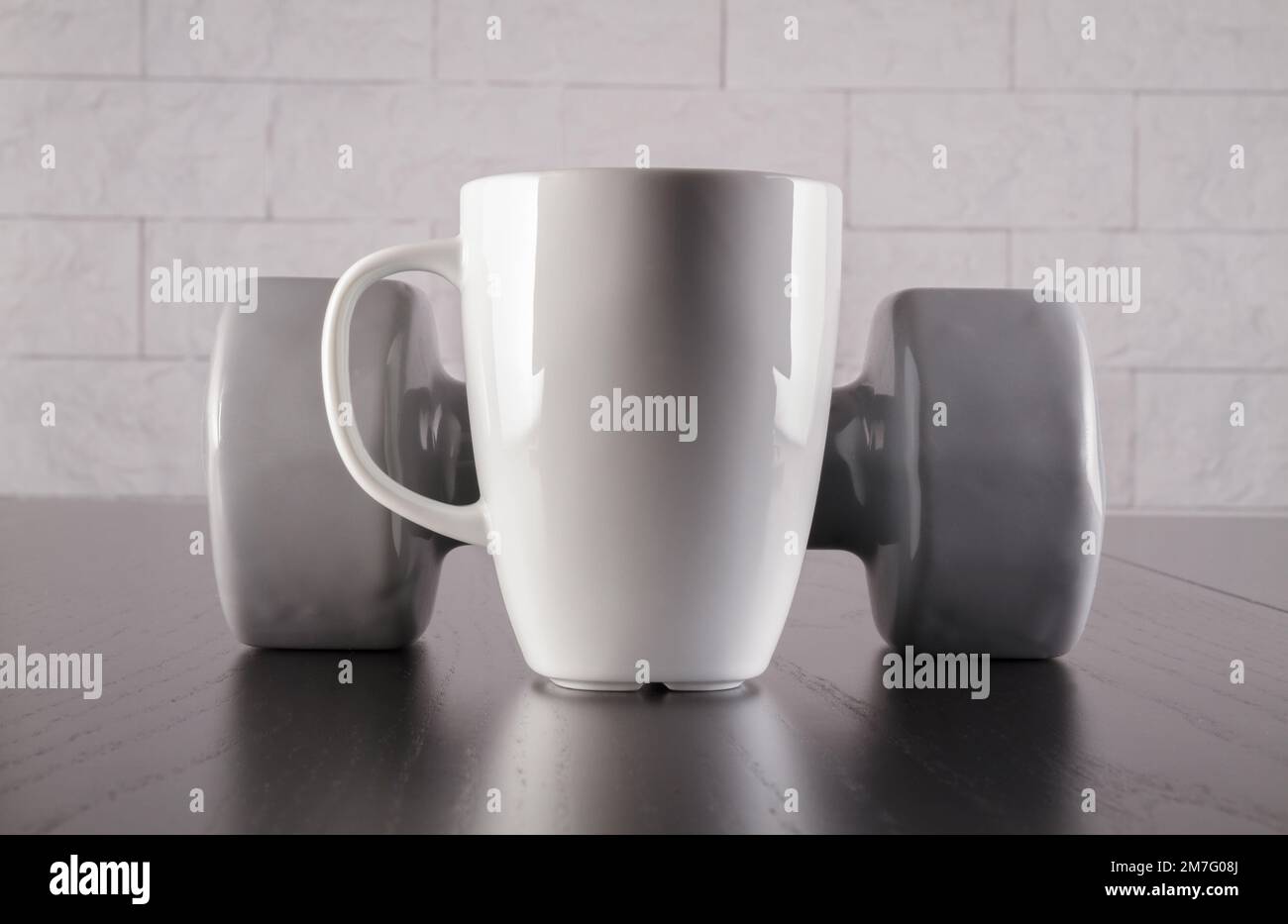 Mug Of Hot Tea Or Coffee And Heavy Dumbbell For Home Gym Workout Stock