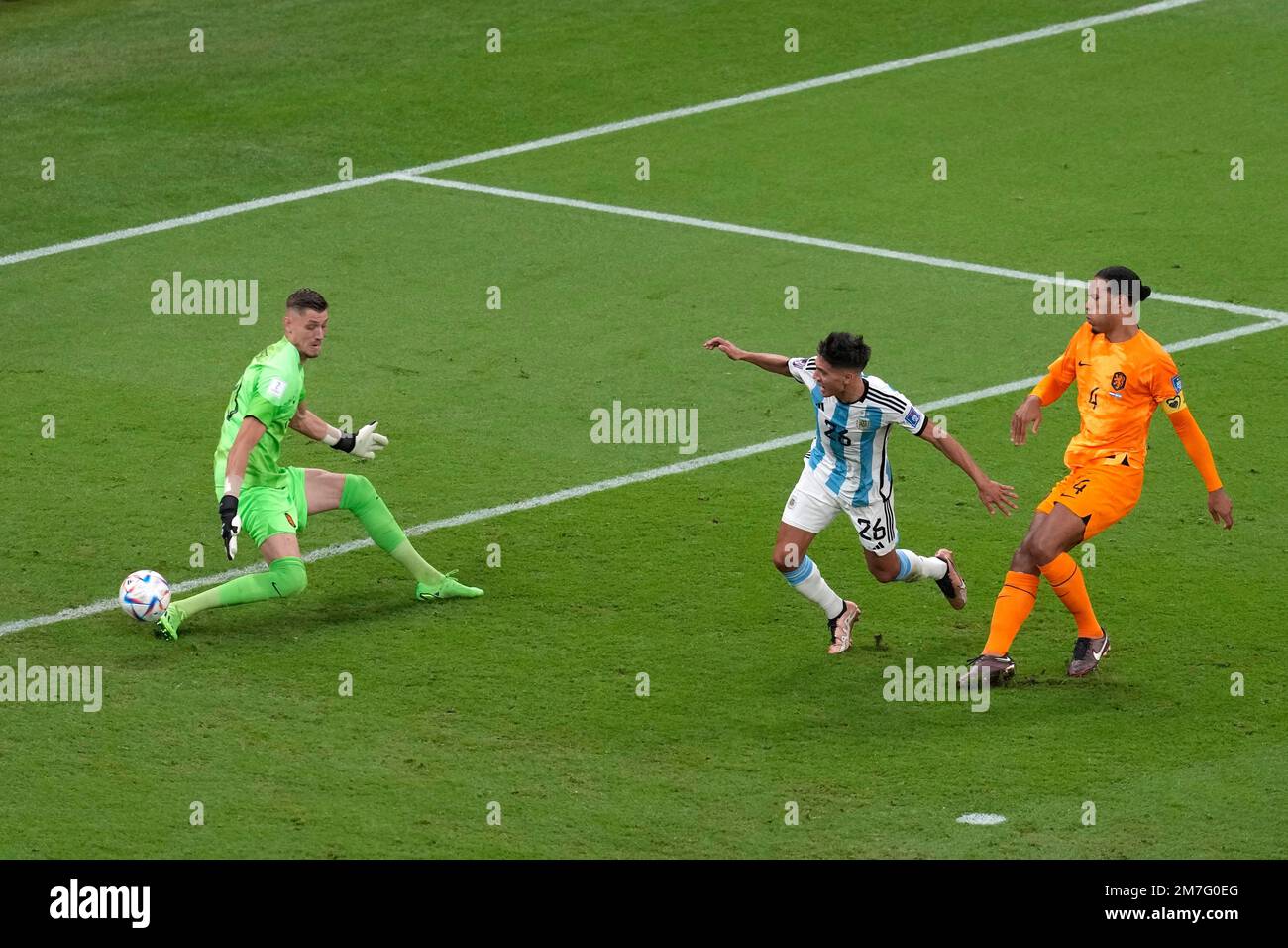 Argentina's Nahuel Molina, second right, scores his side's opening goal ...