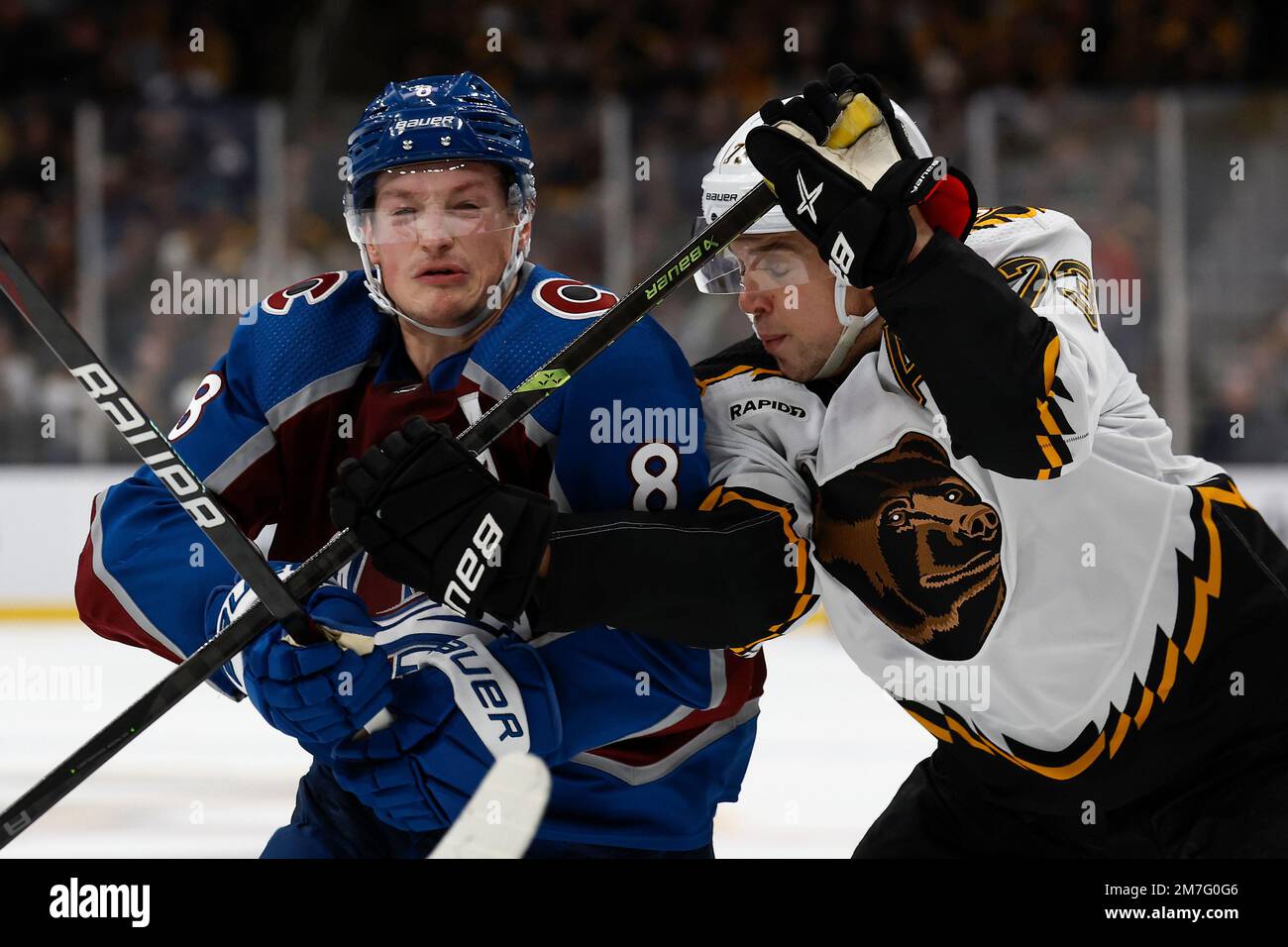 Boston Bruins defenseman Charlie McAvoy tries to hold up Colorado ...