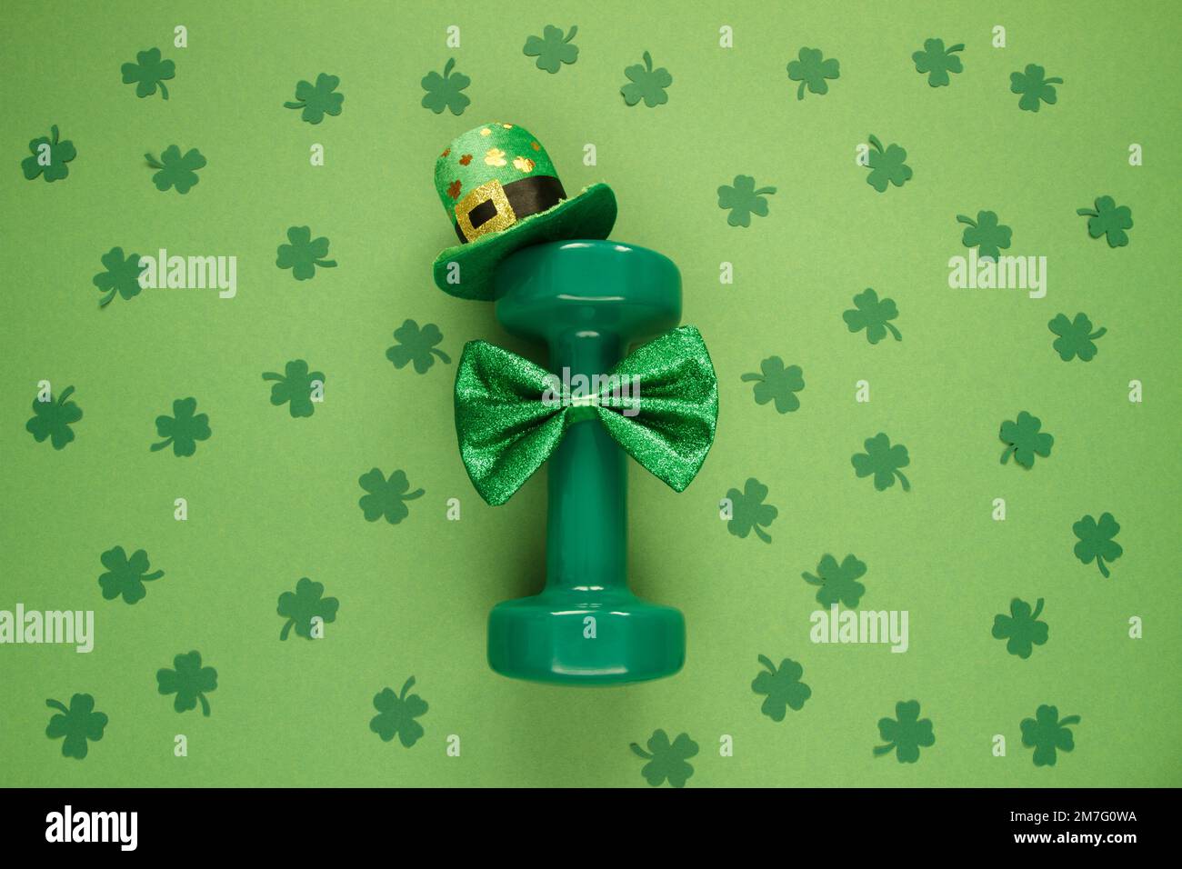 Green gym dumbbell wearing Irish shamrock leaf clover hat and a bow tie ...