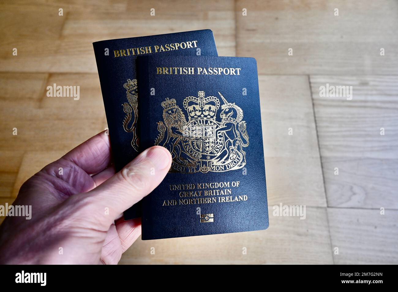 Navy blue passports hi-res stock photography and images - Alamy