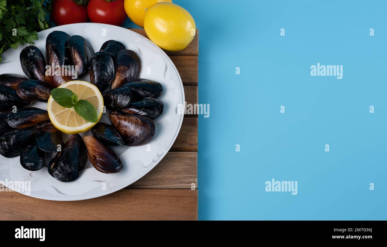 Turkish Street Flavors Stuffed Mussels With Lemon On Blue Background ...